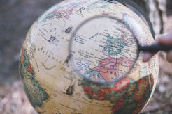 Magnifying Glass World Map Brown Wallpaper Mural - Decorsmarket ...